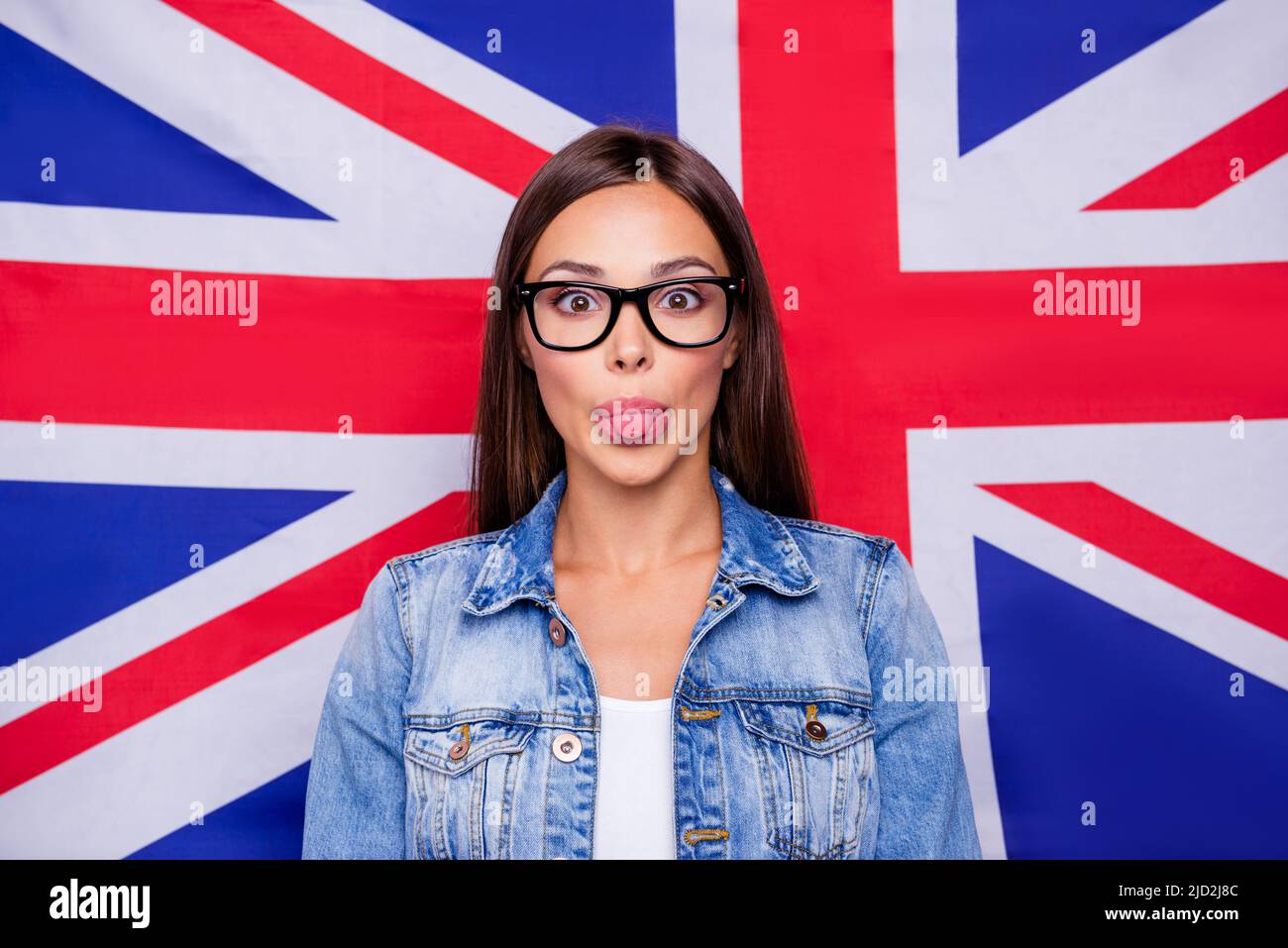 Photo of carefree positive girl showing tongue out look camera isolated ...
