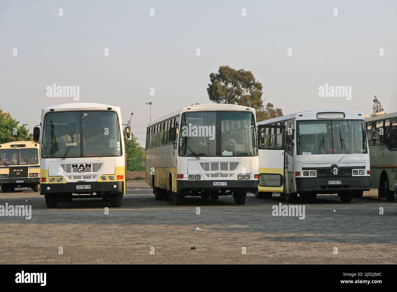 School and other buses in parking lot at the front of the Apartheid ...