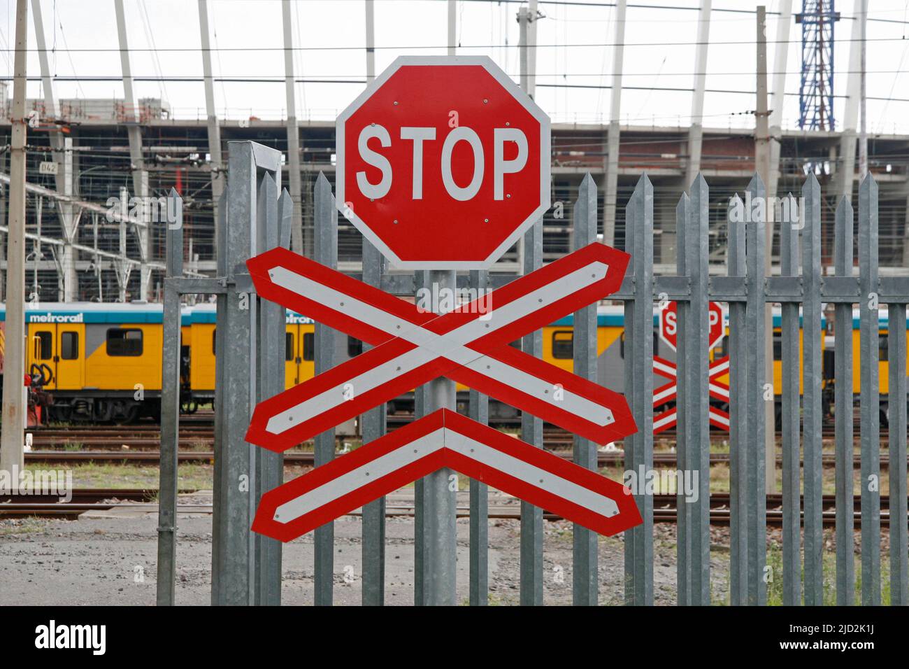 Stop sign at railway crossing at the construction site of Moses Mabhida ...