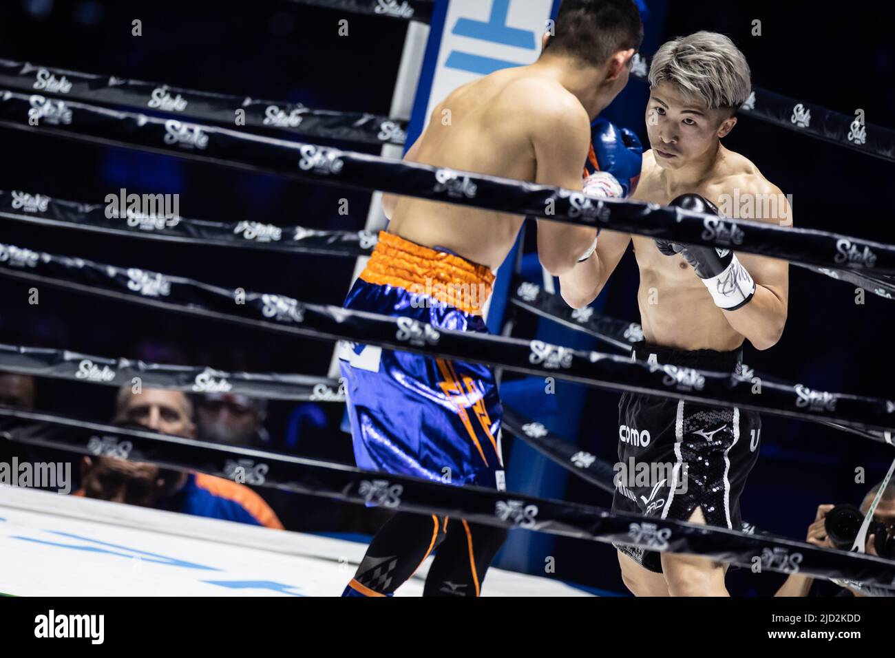 Naoya Inoue (black gloves) of Japan and Nonito Donaire (blue gloves) of ...