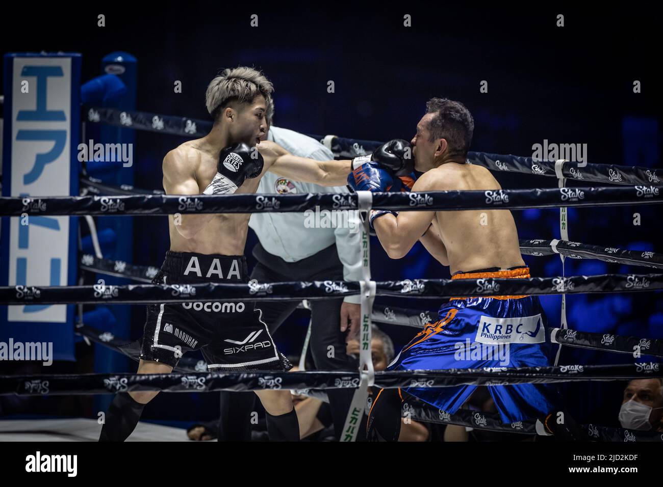 Naoya Inoue (black gloves) of Japan and Nonito Donaire (blue gloves) of ...