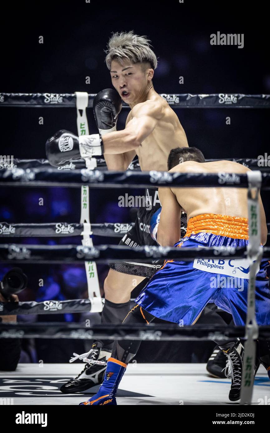 Naoya Inoue (black gloves) of Japan and Nonito Donaire (blue gloves) of ...