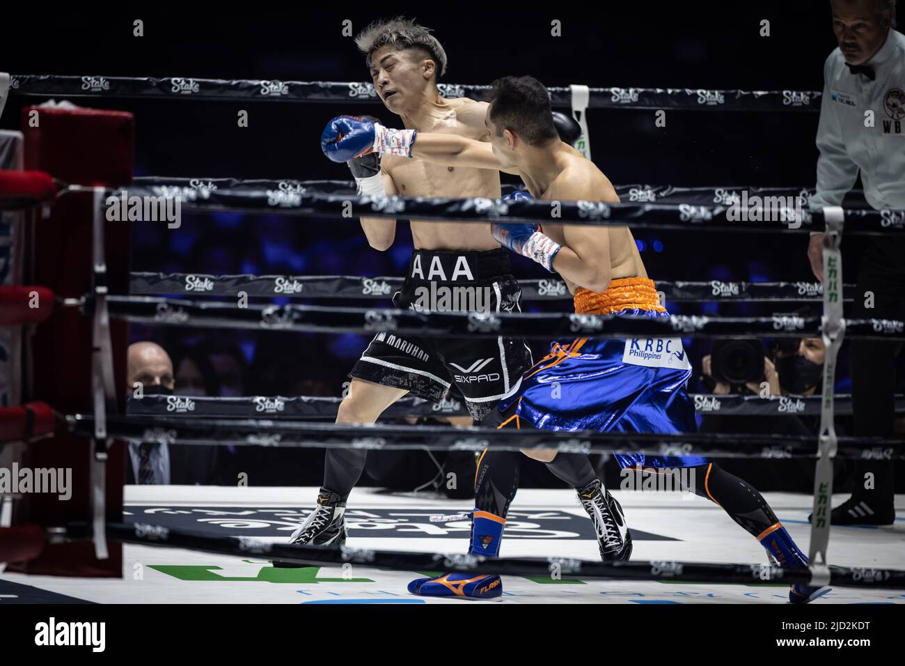 Naoya Inoue (black gloves) of Japan and Nonito Donaire (blue gloves) of ...