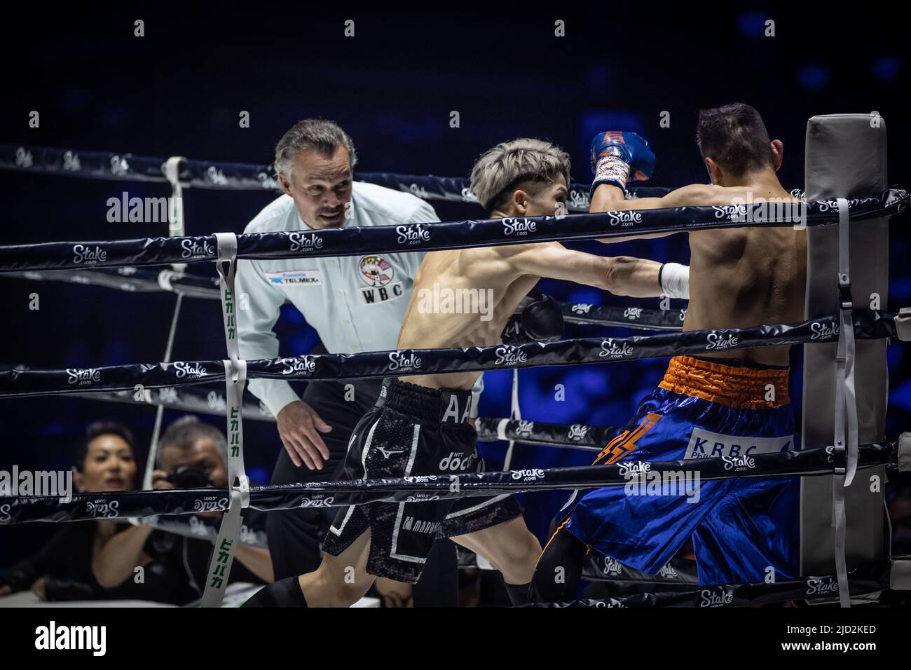 Naoya Inoue (black gloves) of Japan and Nonito Donaire (blue gloves) of ...