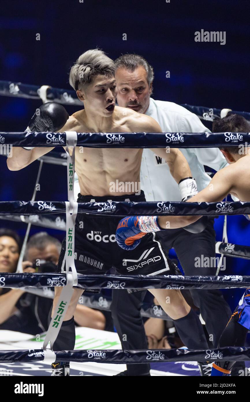 Naoya Inoue (black gloves) of Japan and Nonito Donaire (blue gloves) of ...