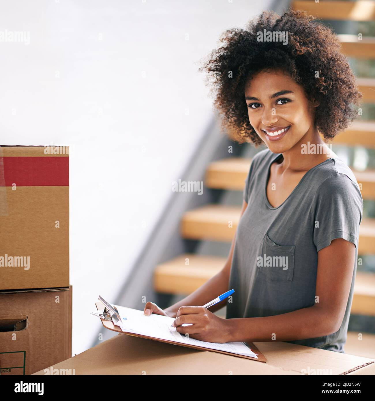 Woman looking at list home hi-res stock photography and images - Alamy