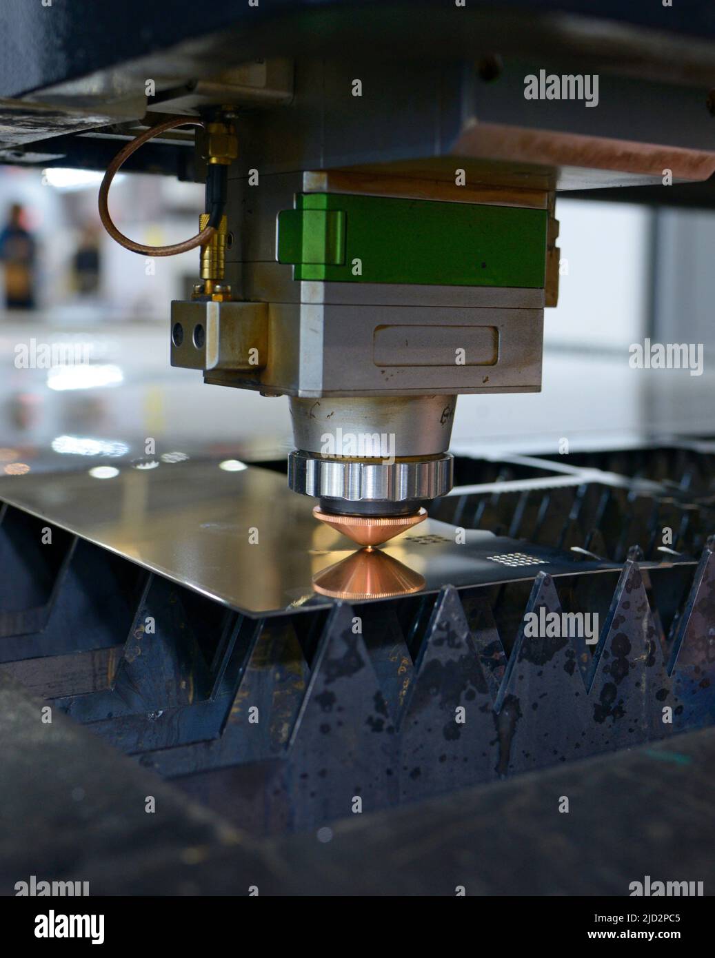 Laser machine cutting metal sheet, sparks coming Stock Photo - Alamy