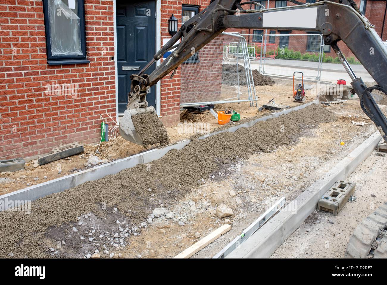 Construction workers finishing construction of new residential house ...