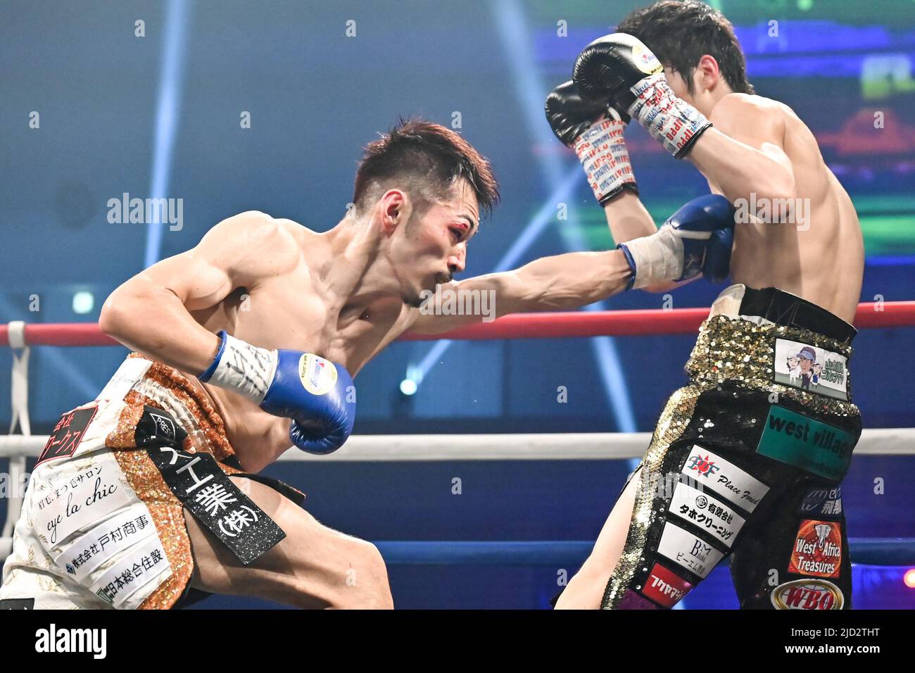 Reiya Abe (blue gloves) and Hinata Maruta (black gloves) compete during ...