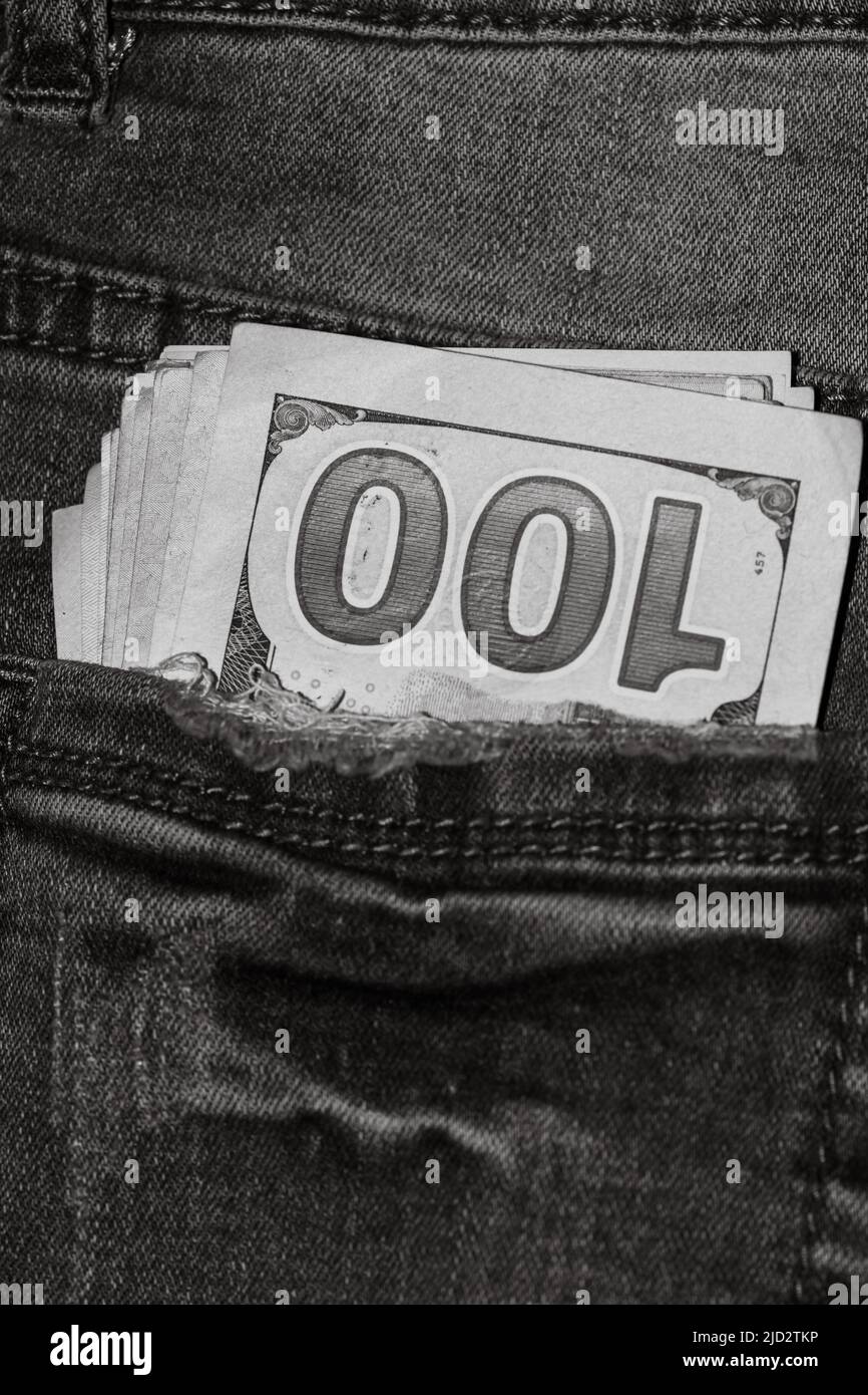 Banknotes, money in a jeans pocket, close up. Money stick out of the ...