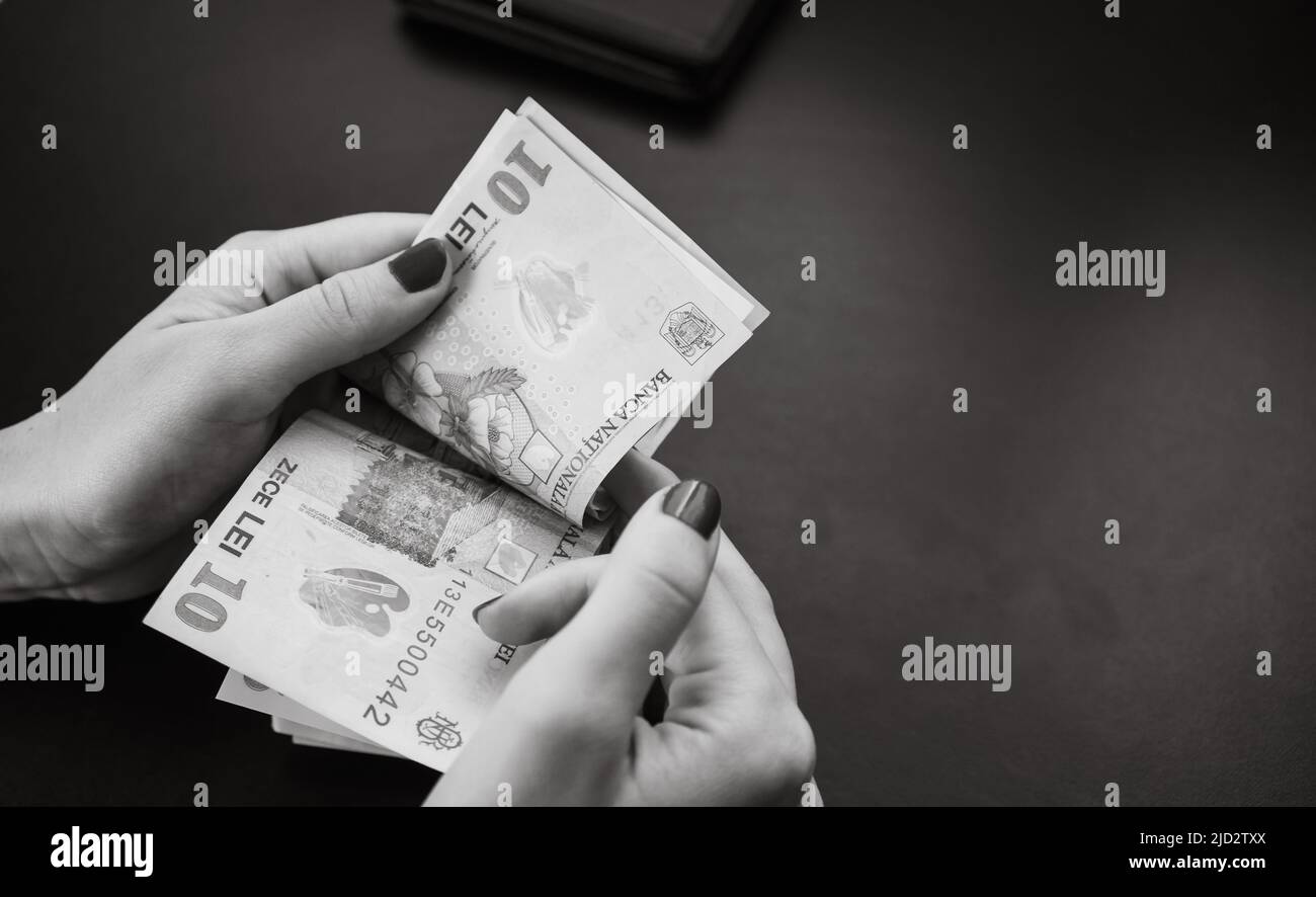 Woman counting money, counting LEI close up Stock Photo - Alamy
