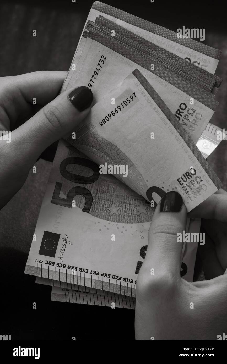 Woman counting money, counting EURO close up Stock Photo - Alamy