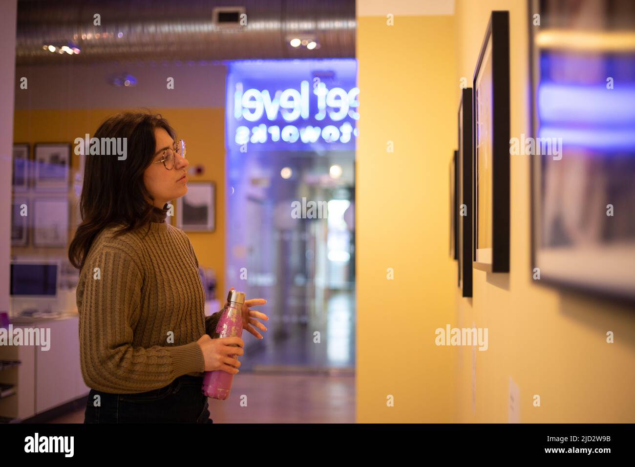 Rachel McDermott looking at photography in the Street Level Photoworks ...