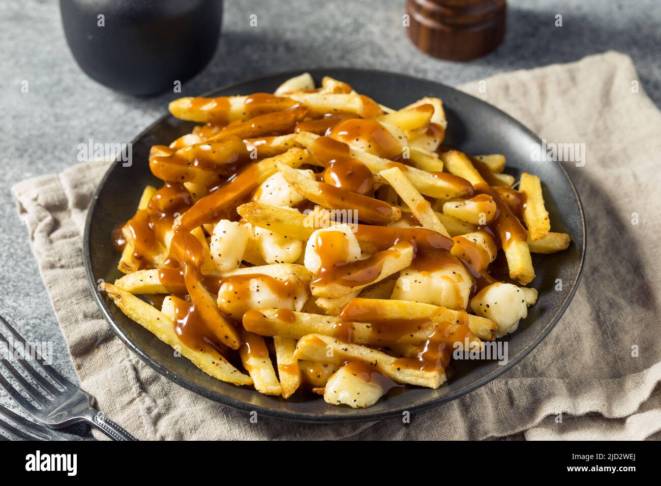 Homemade Cheesey Poutine French Fries with Gravy and Cheese Curds Stock ...