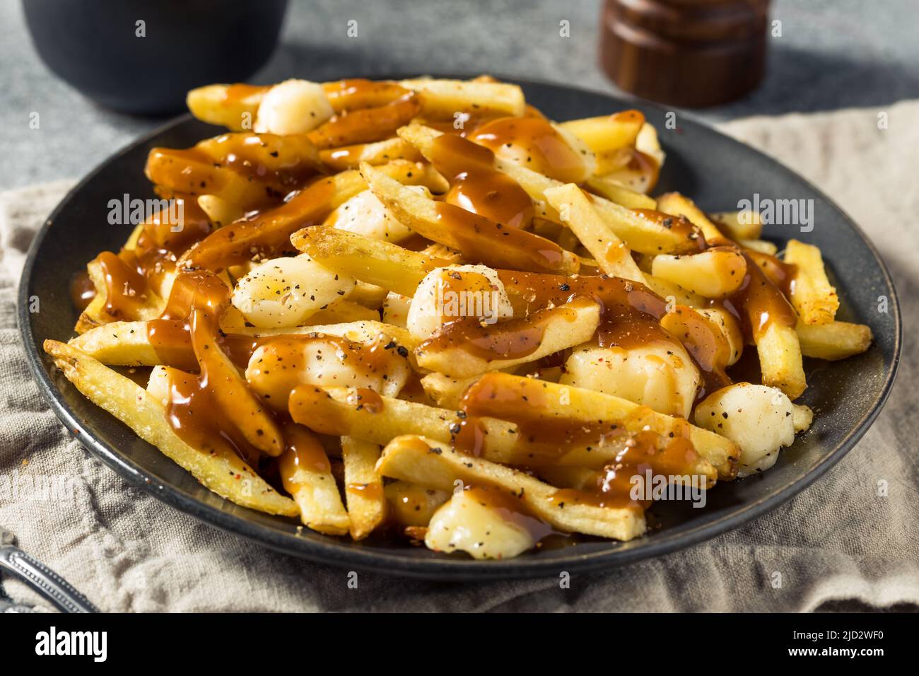 Homemade Cheesey Poutine French Fries with Gravy and Cheese Curds Stock ...