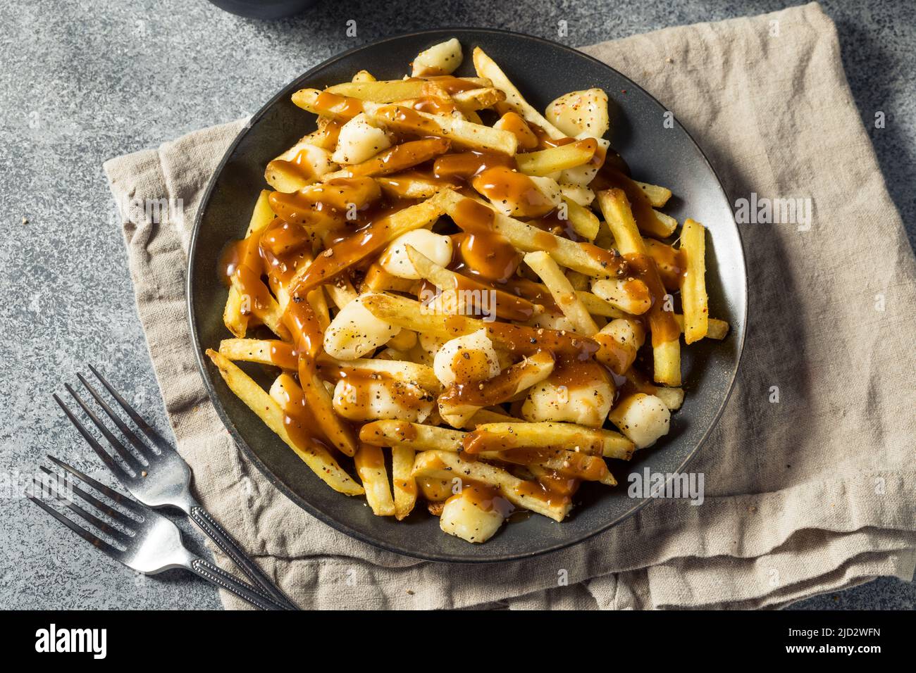 Homemade Cheesey Poutine French Fries with Gravy and Cheese Curds Stock ...