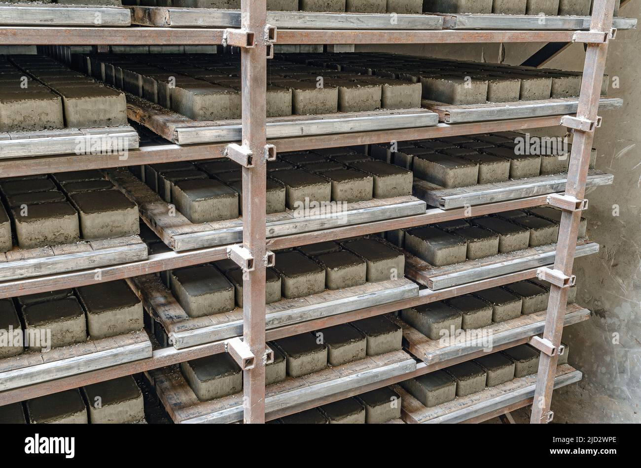Side view of paving slabs drying on factory shelves. Production ...