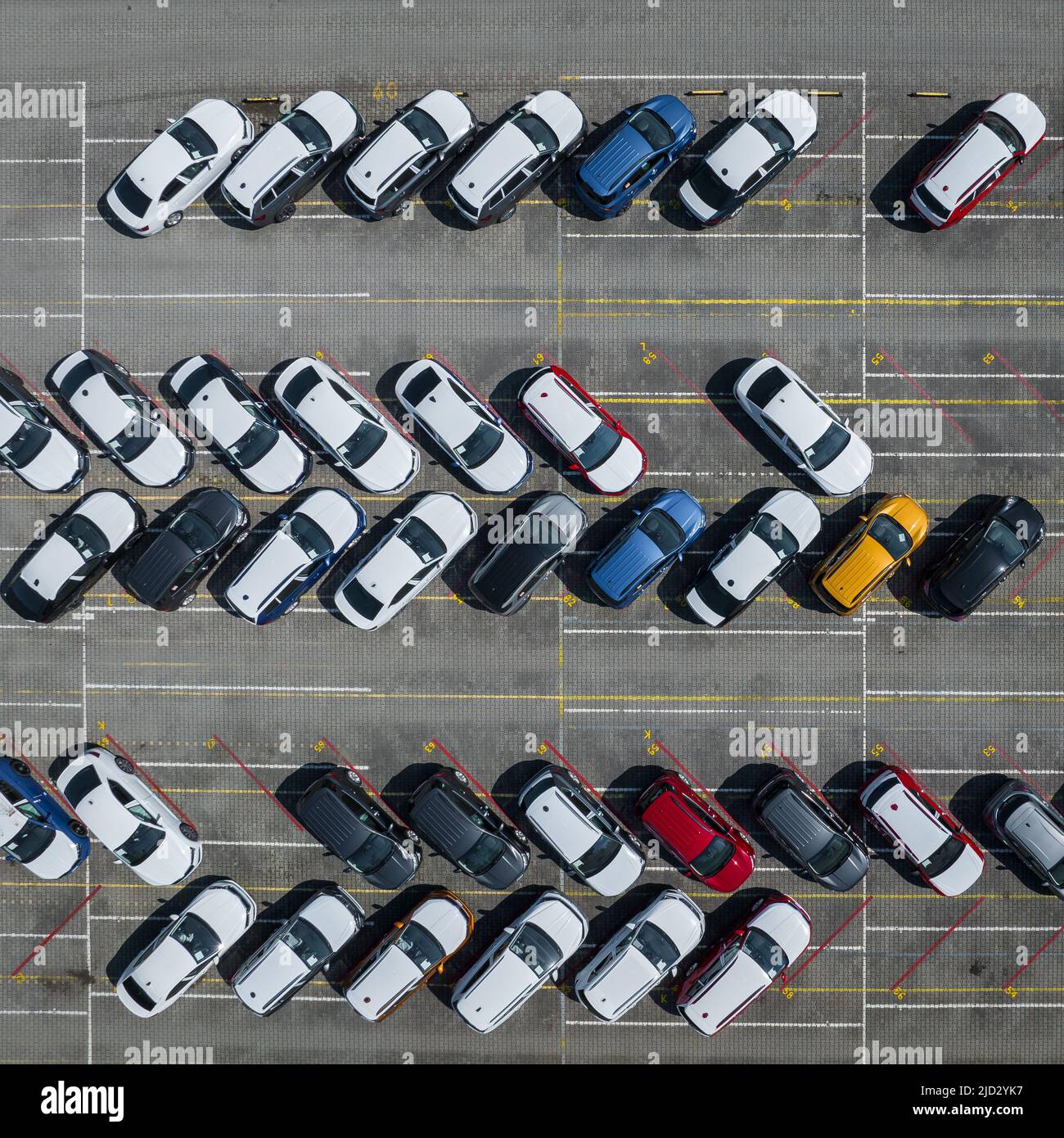 Aerial view new car lined up in the port for import and export business ...
