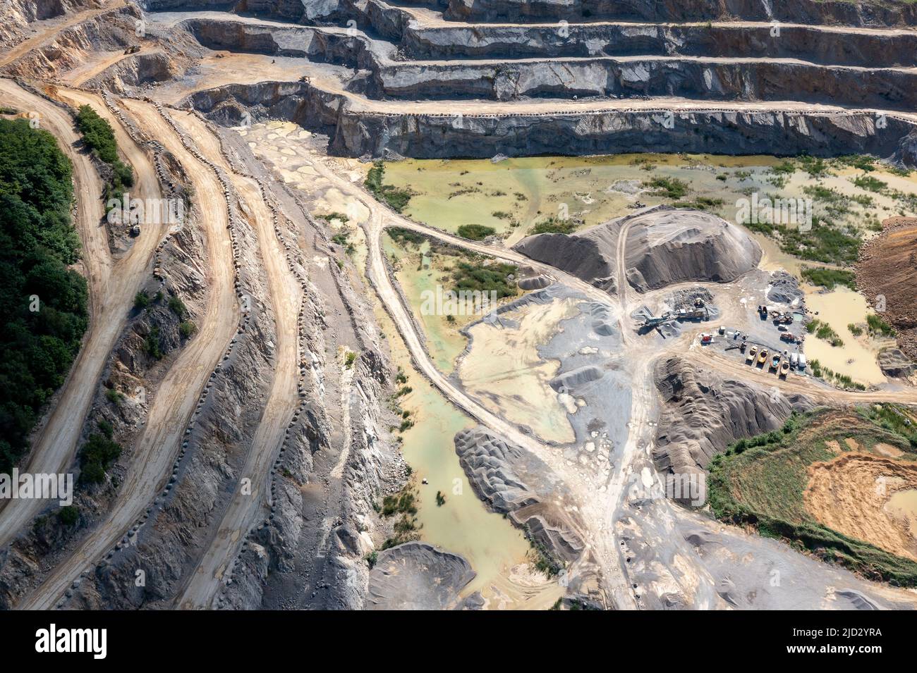 Aerial view of industrial terraces on mineral mine. Opencast mining ...