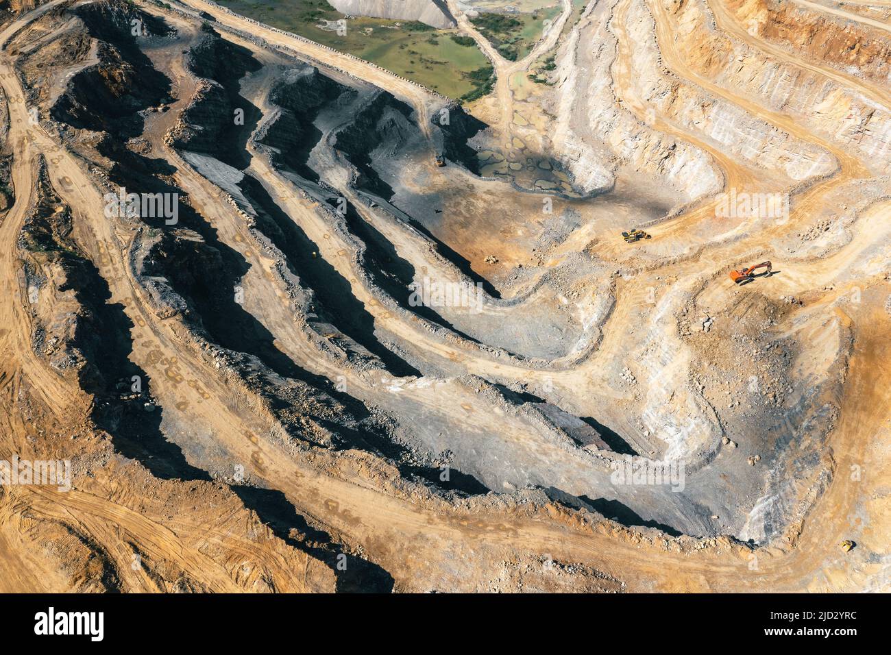 Aerial view of industrial terraces on mineral mine. Opencast mining ...