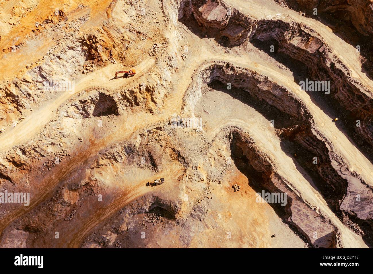 Aerial view of industrial terraces on mineral mine. Opencast mining ...