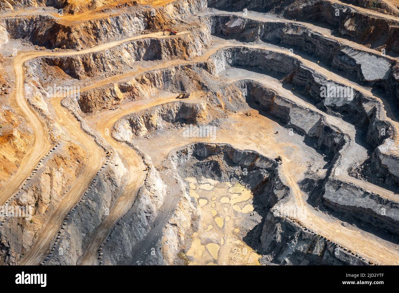 Aerial view of industrial terraces on mineral mine. Opencast mining ...