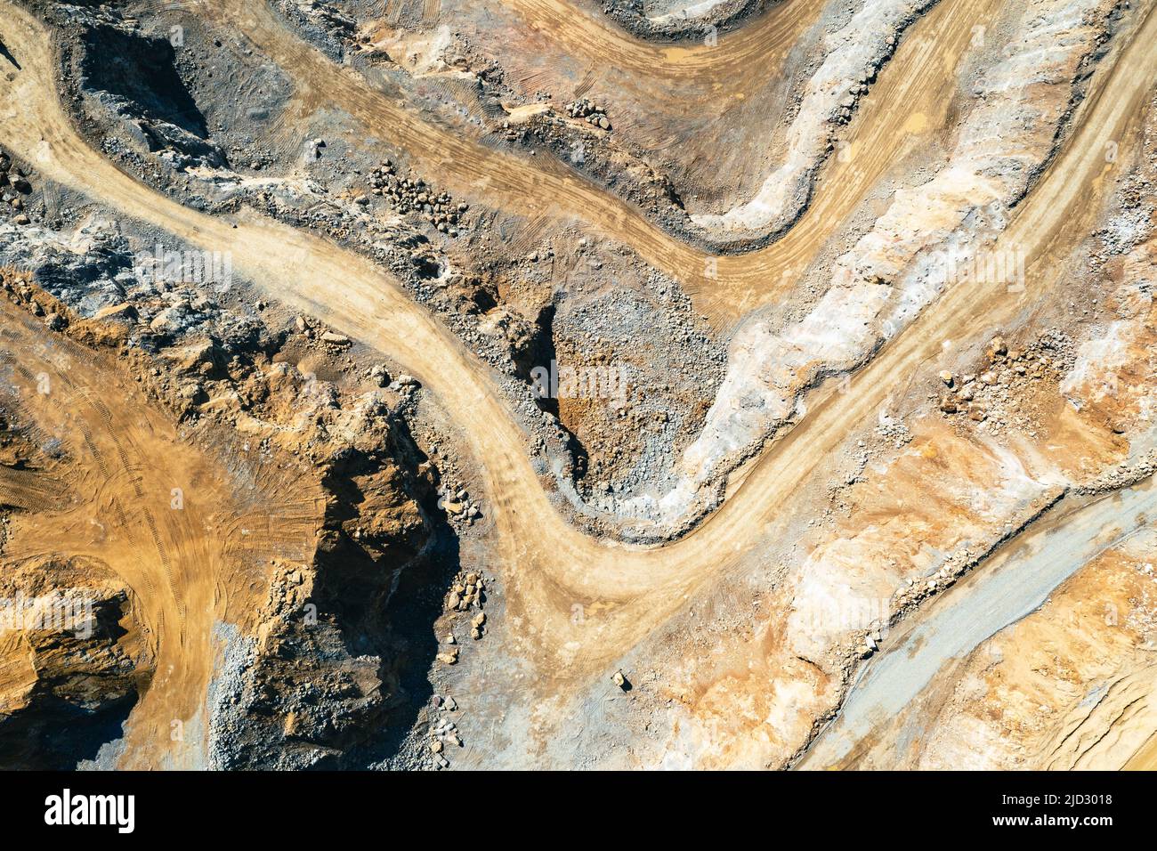 Aerial view of industrial terraces on mineral mine. Opencast mining ...