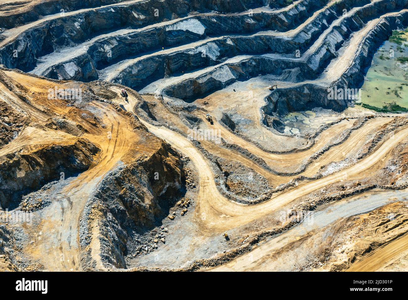 Aerial view of industrial terraces on mineral mine. Opencast mining ...
