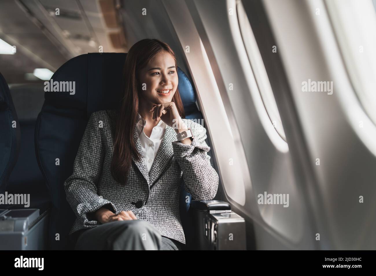 Happy plane passenger hi-res stock photography and images - Alamy