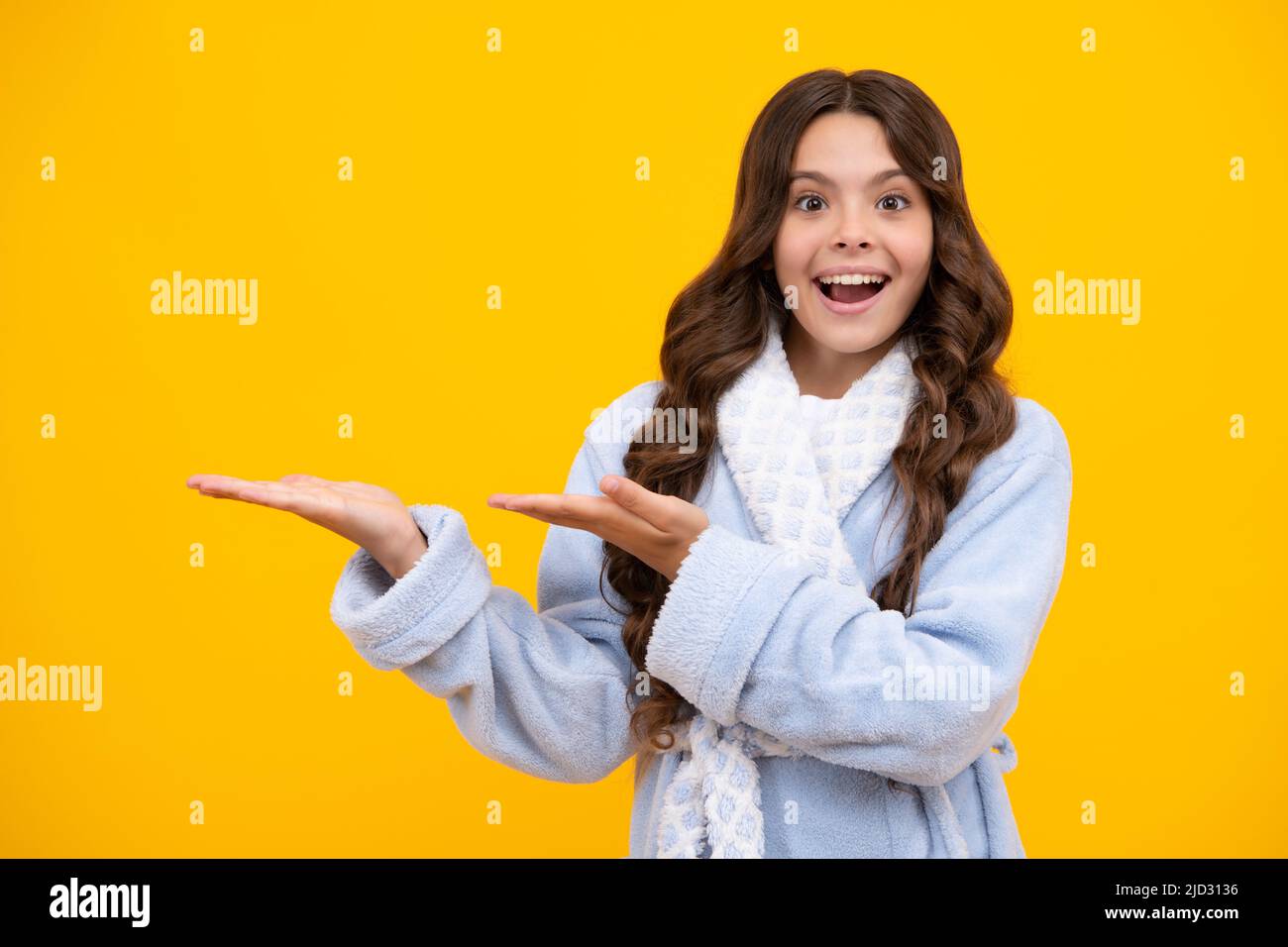 Close up portrait of teenager child girl showing at copy space ...