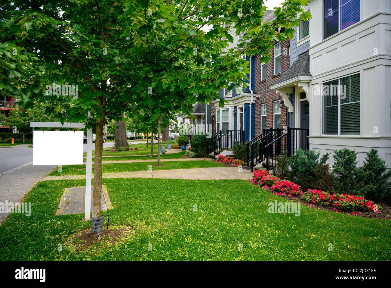 The marketing for sale sign boards of local estate agent outside homes ...