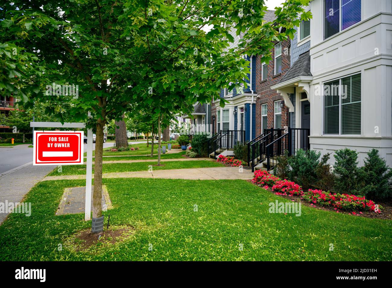 The marketing for sale sign boards of local estate agent outside homes ...