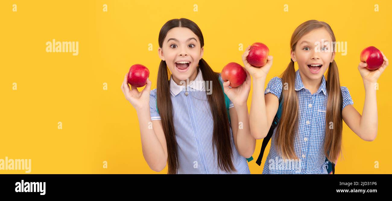 Happy kids hold apples for healthy back to school snack yellow ...
