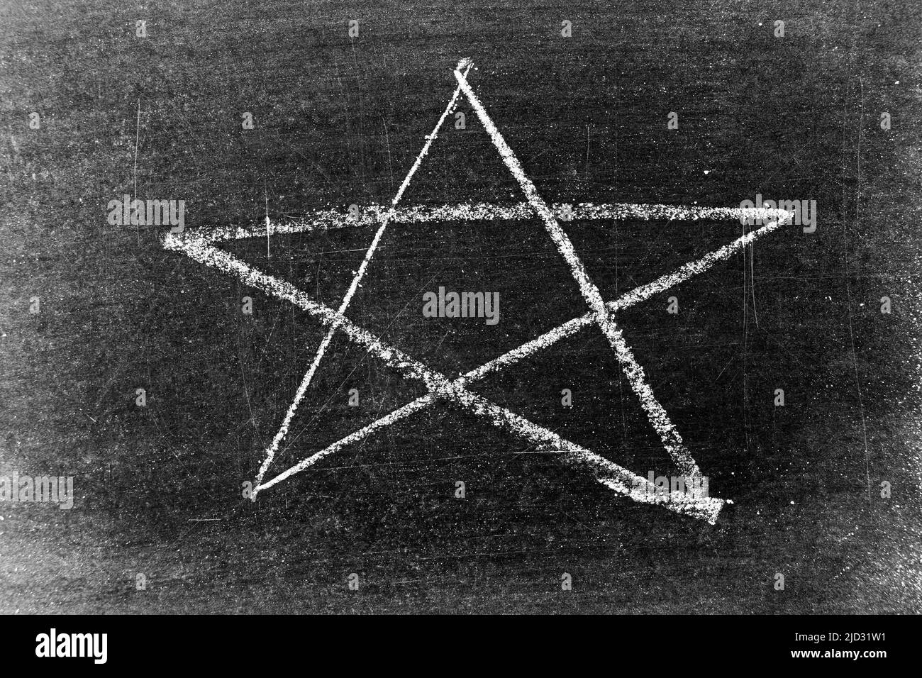 White chalk drawing in star shape on black board background Stock Photo ...