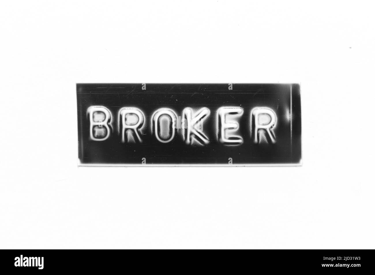 Black color banner that have embossed letter with word broker on white ...