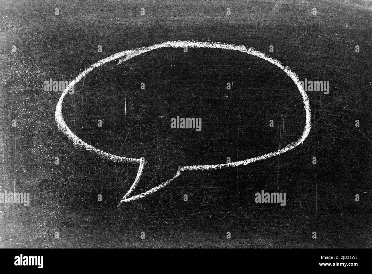 White color chalk hand drawing in round bubble speech shape with blank ...