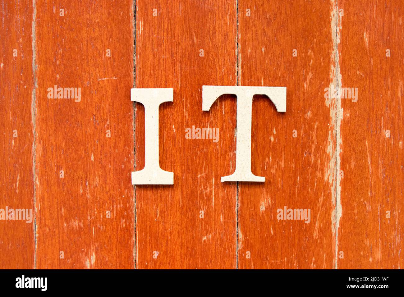 Alphabet letter in word IT (Abbreviation of information technology) on ...