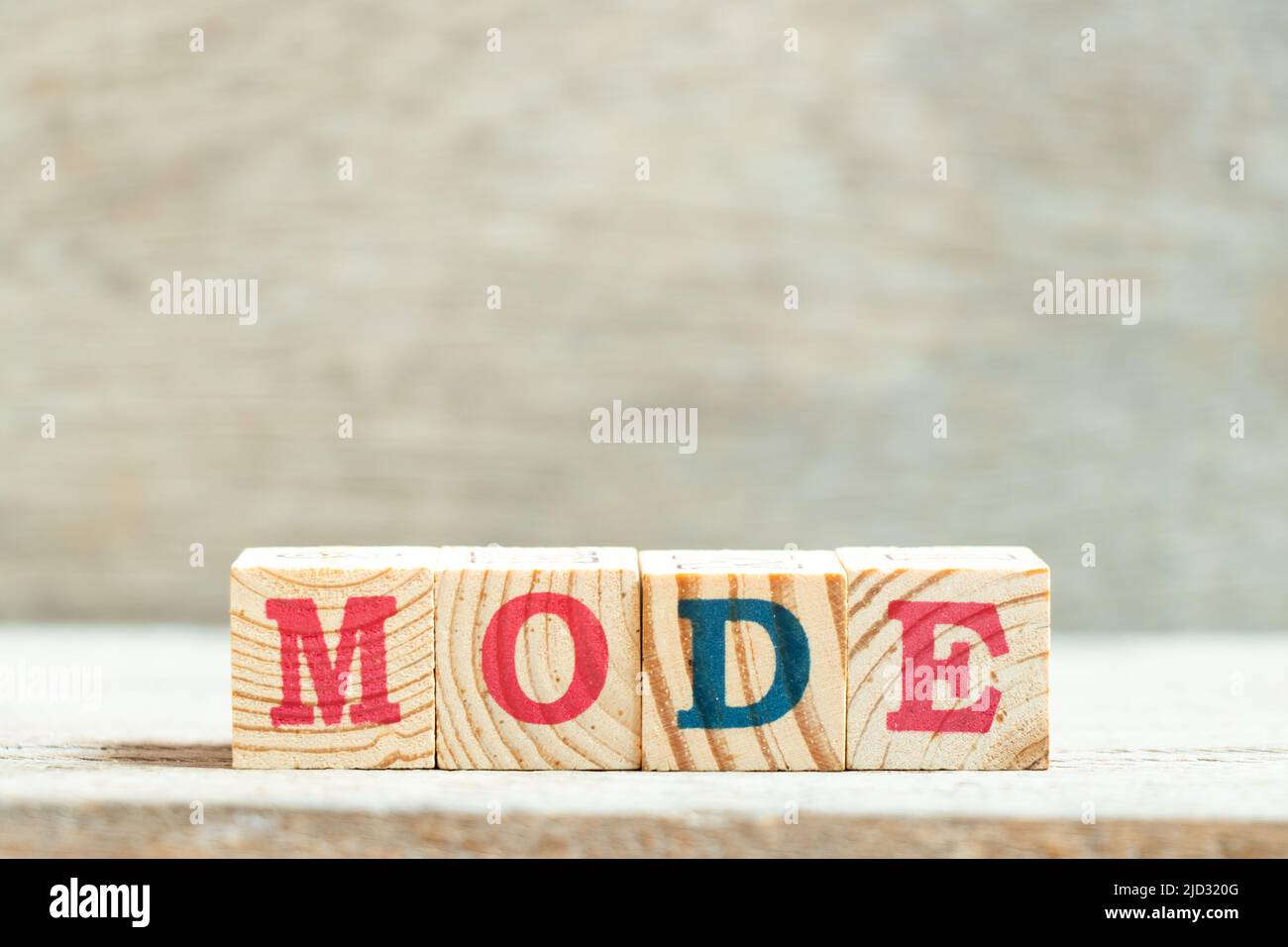 Alphabet letter block in word mode on wood background Stock Photo - Alamy