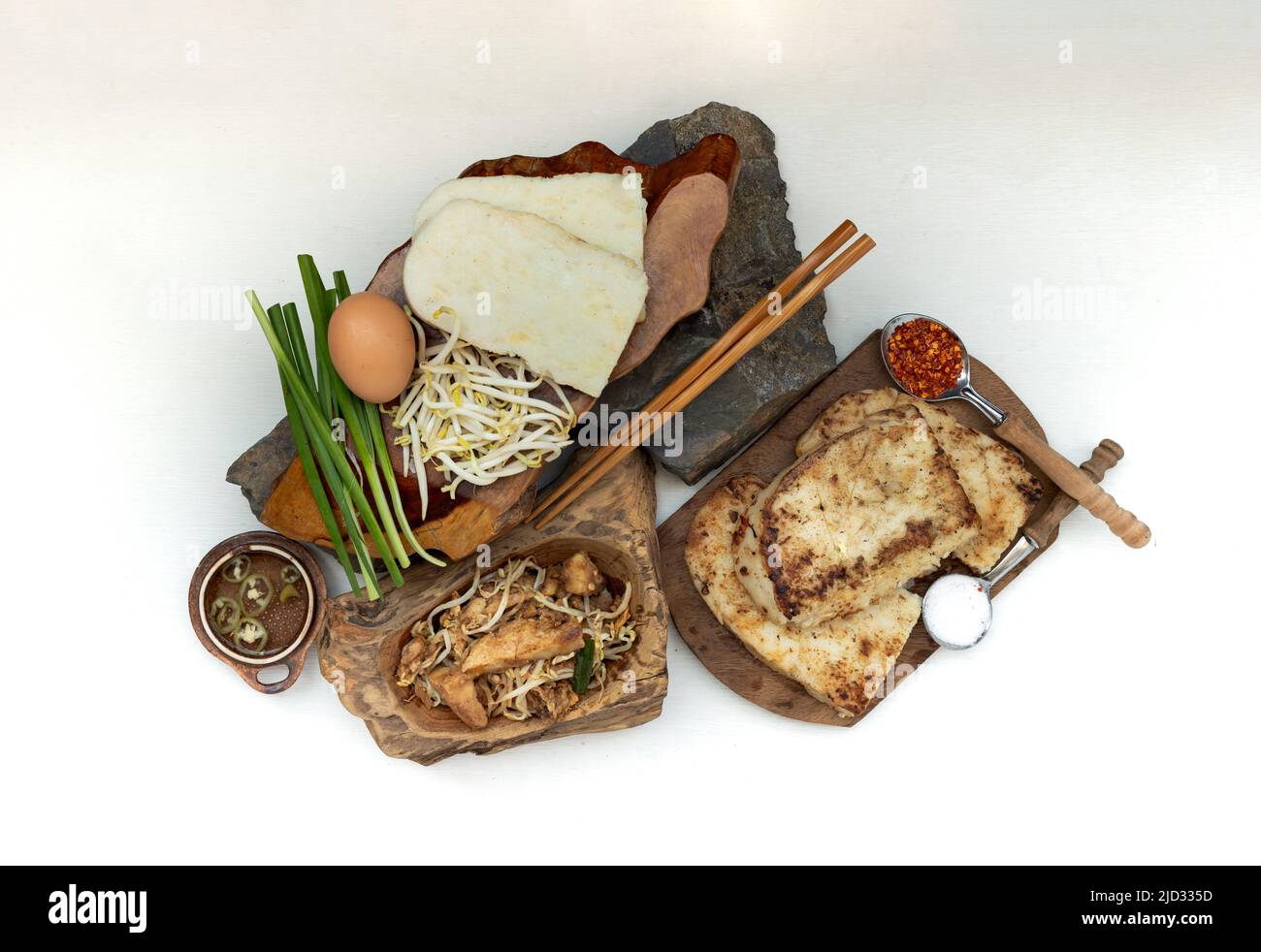 Stir-fried soft turnip cake or Fried radish cake (chai tow kway) with ...