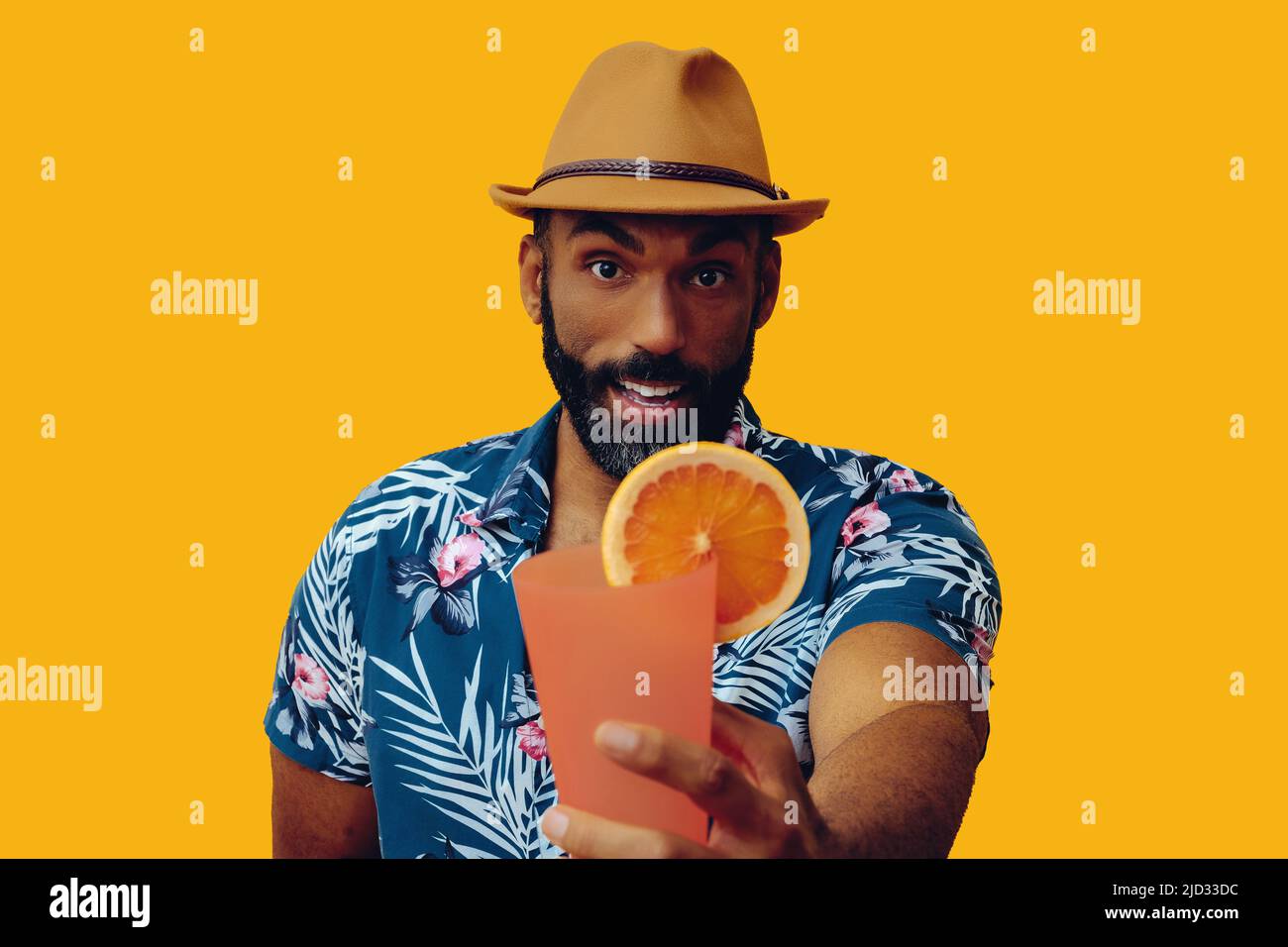 happy bearded mid adult african american man wearing Hawaiian shirt and hat smiling offering ...