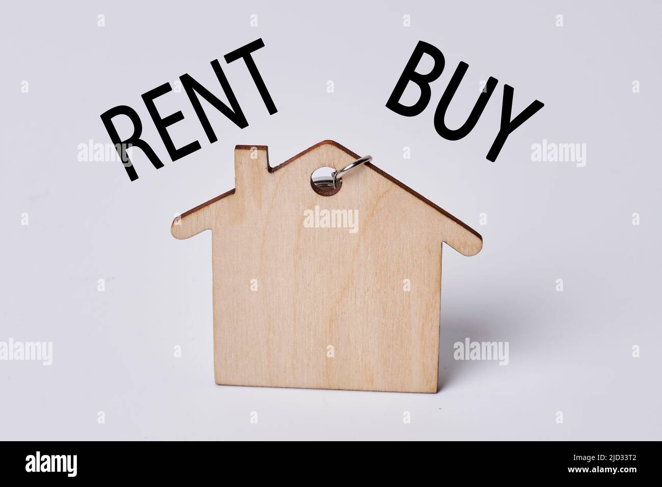 Wooden house model on white background, Text buy or rent. Home ...