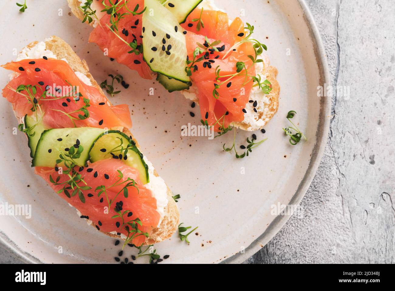 Sandwiches. Salmon toast with cream cheese, cucumber, black sesame and ...