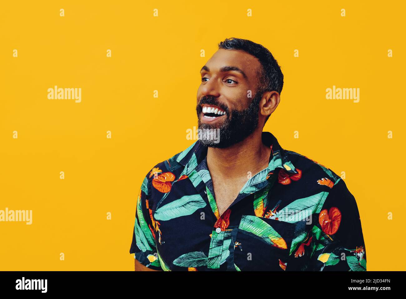 happy smiling african american man wearing Hawaiian shirt looking away ...