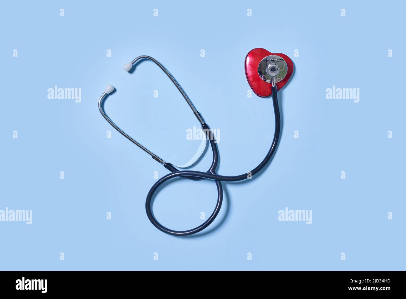 A blue phonoscope and an image of a red heart, close-up, there is a ...