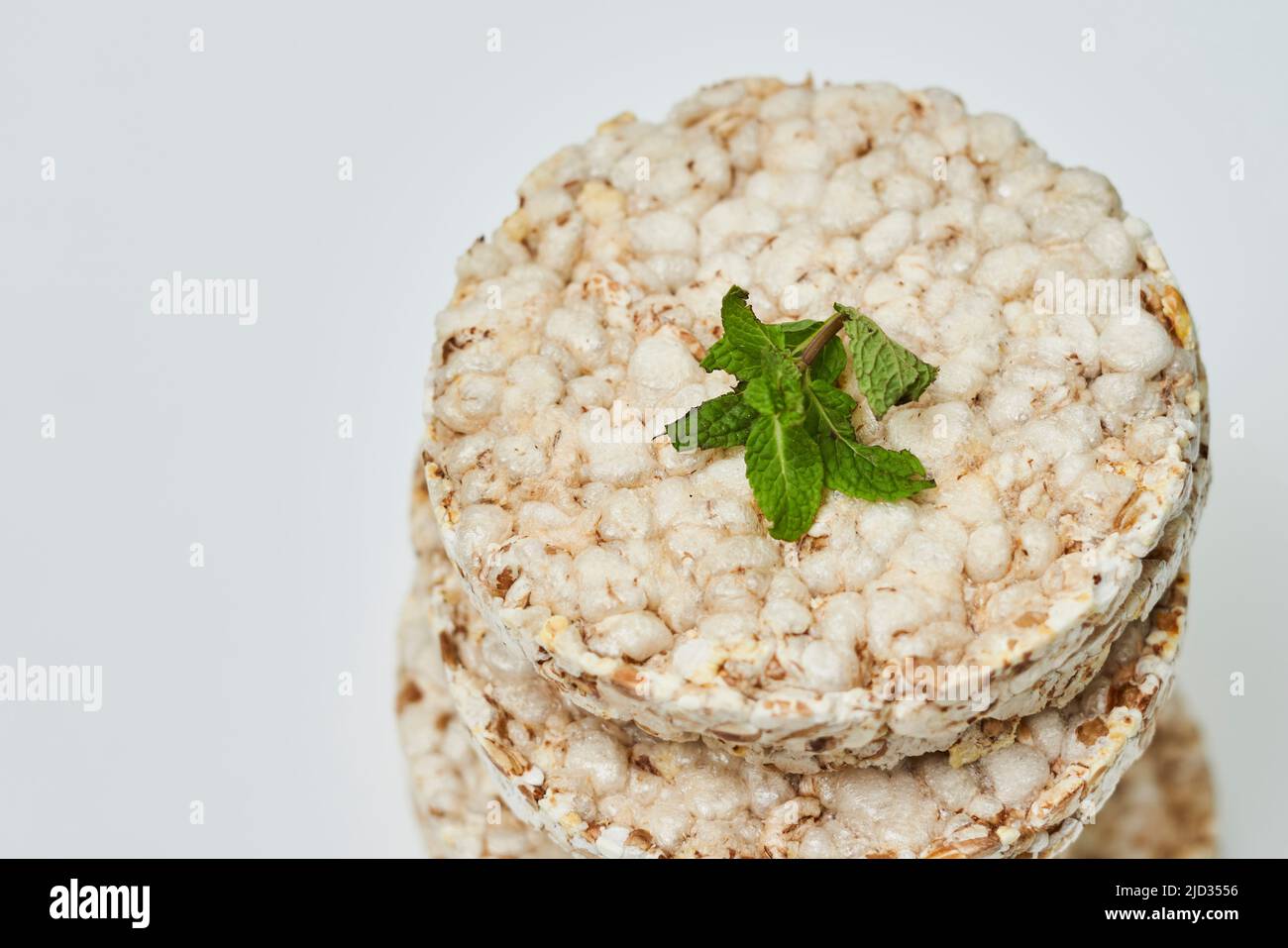 Stack of rice cakes on white background. Top view Stock Photo - Alamy