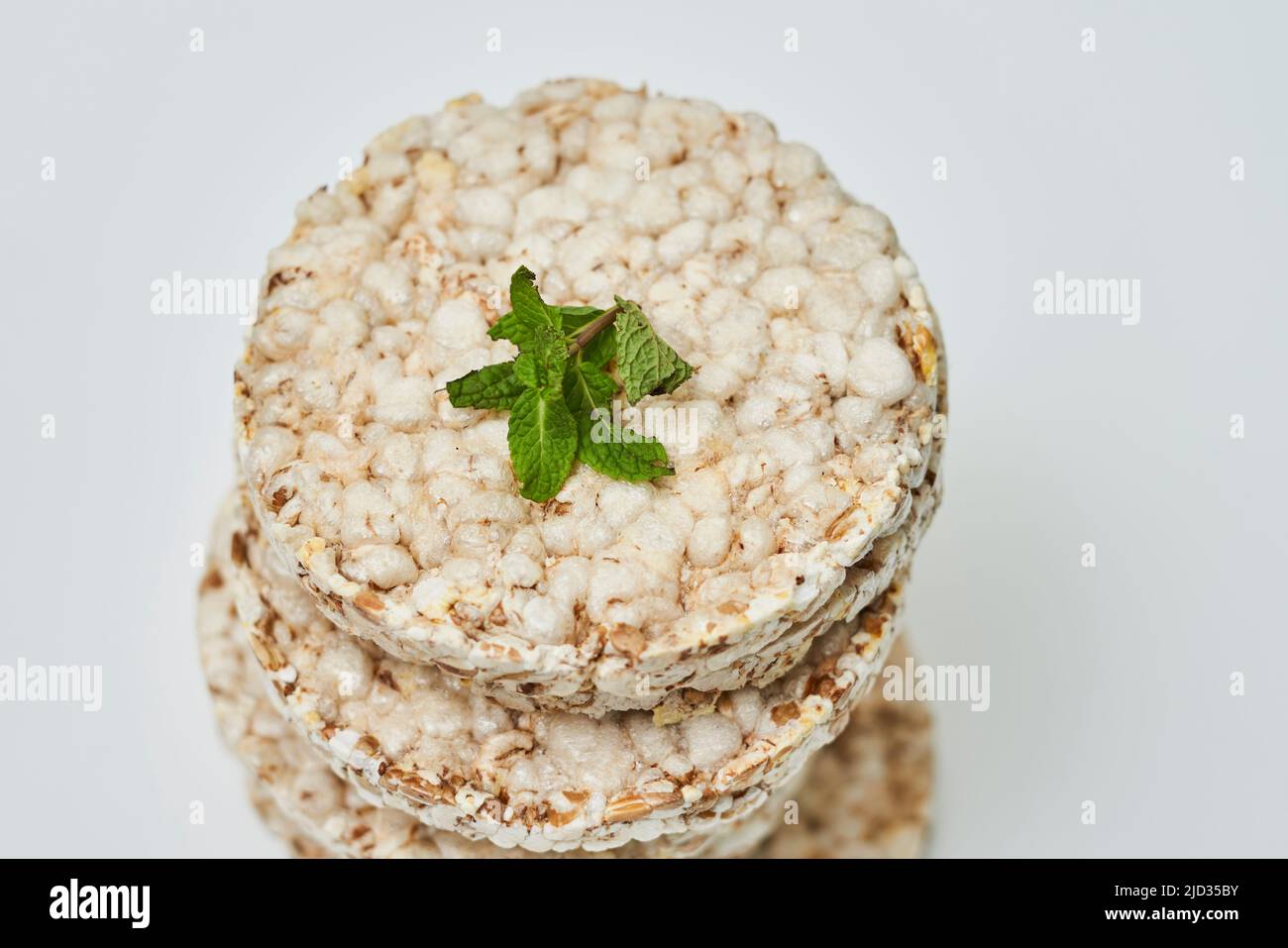 Stack of rice cakes on white background. Top view Stock Photo - Alamy