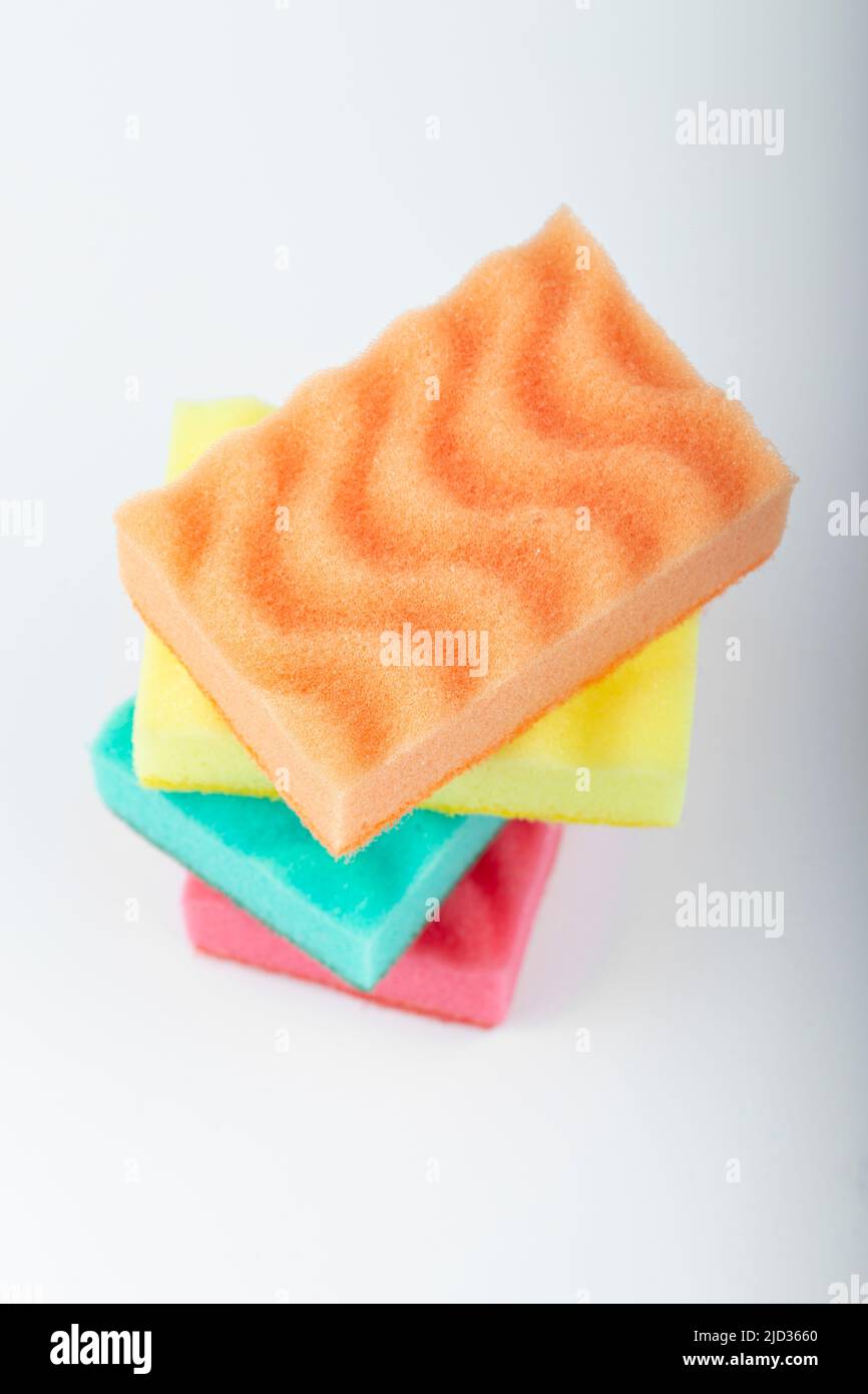 Multi-colored sponges for dishes close up on a white background Stock ...