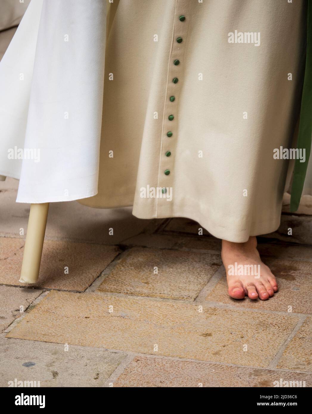 A penitent parades barefoot through the streets of Úbeda Stock Photo ...