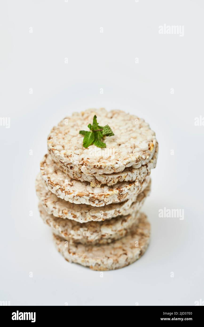 Stack of rice cakes on white background Stock Photo - Alamy