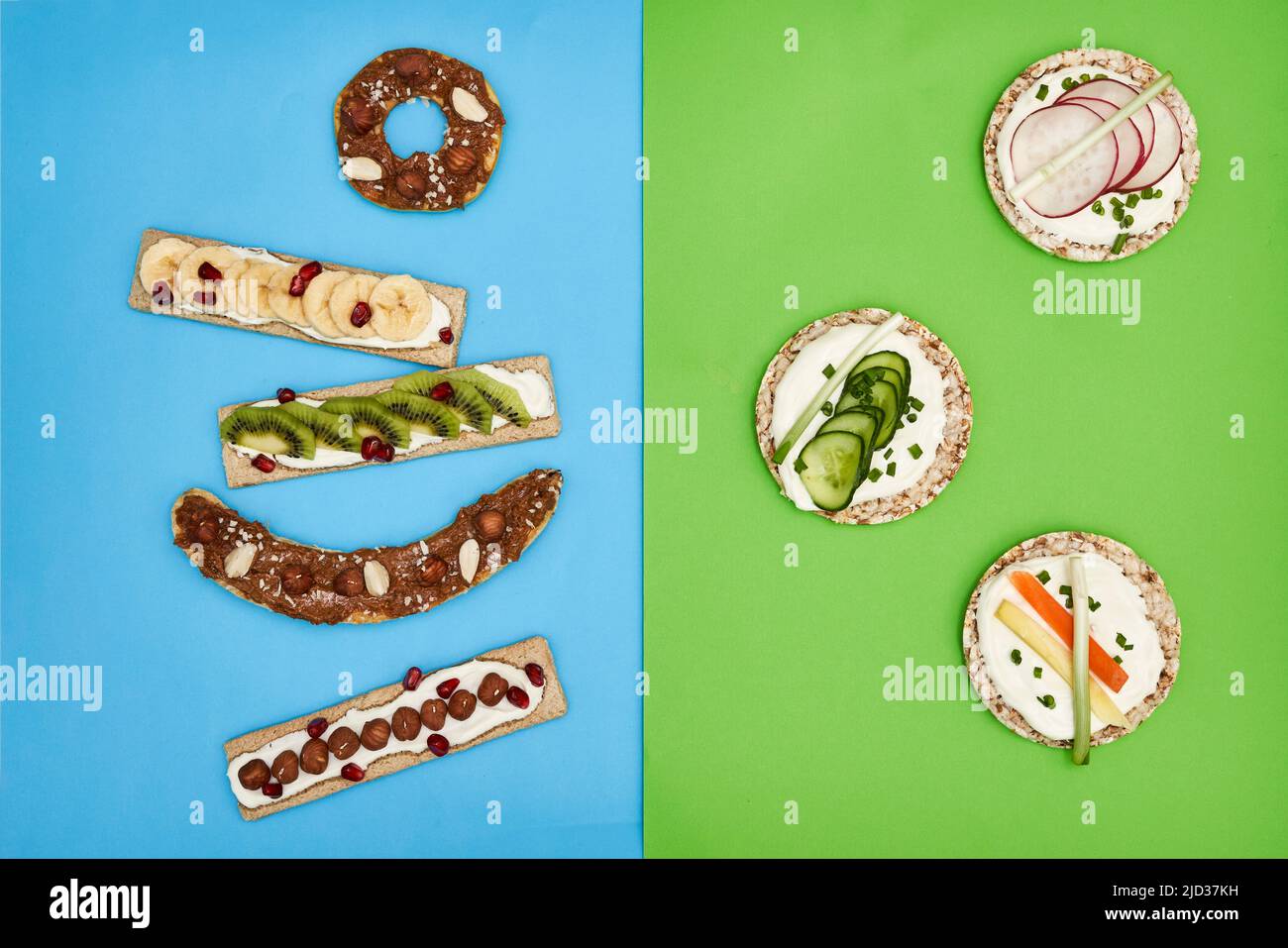 Rice cake and crispbreads with cream cheese, vegetables and fruits on ...